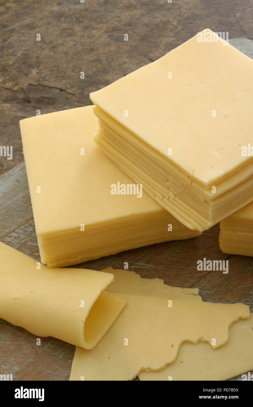 sliced cheese portions Stock Photo - Alamy