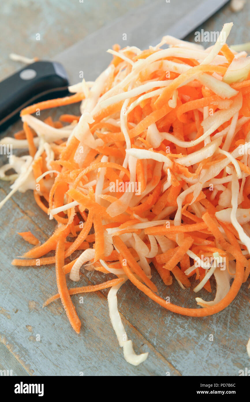making vegetable coleslaw Stock Photo - Alamy