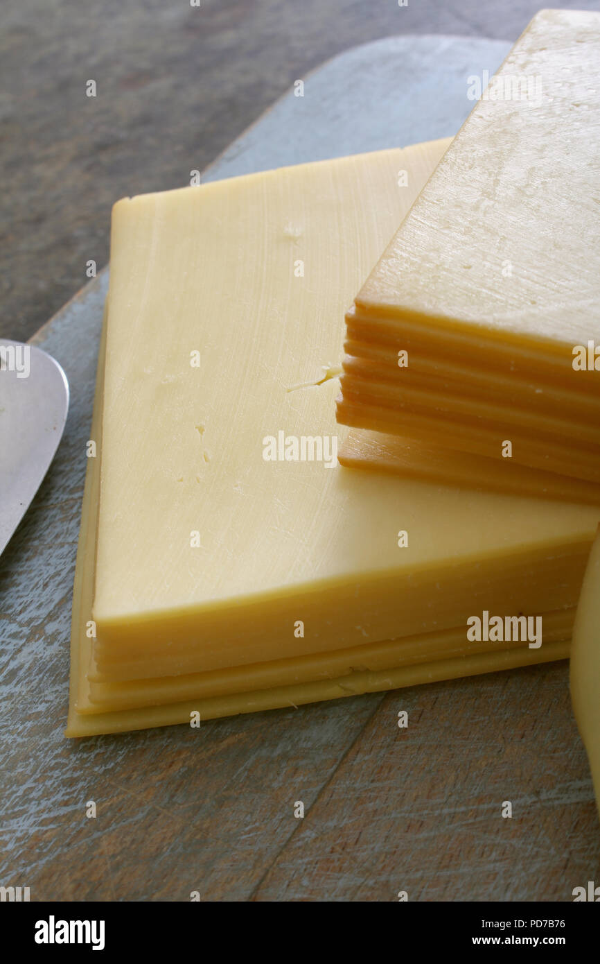sliced cheese portions Stock Photo - Alamy