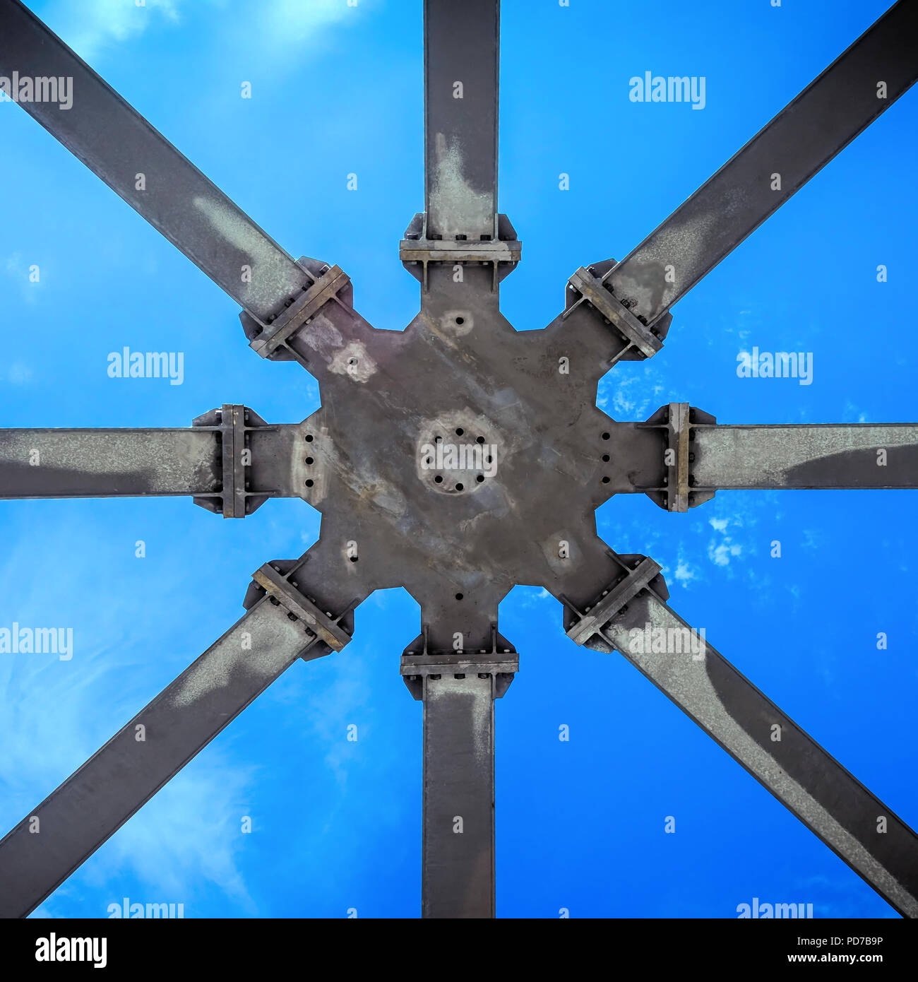 Star-shaped supporting structure taken from below against the blue sky ...