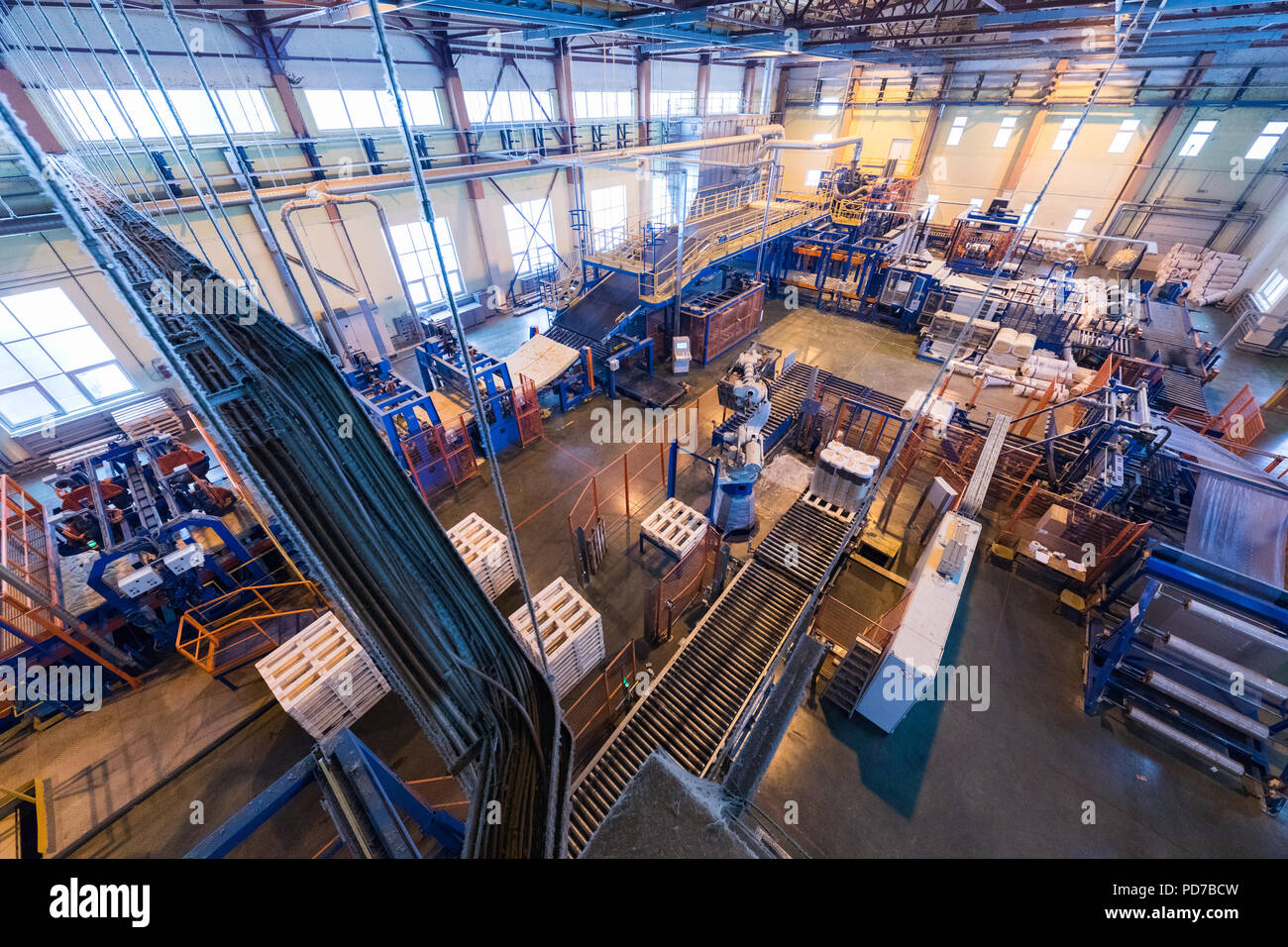 Fiberglass production industry equipment at manufacture background ...