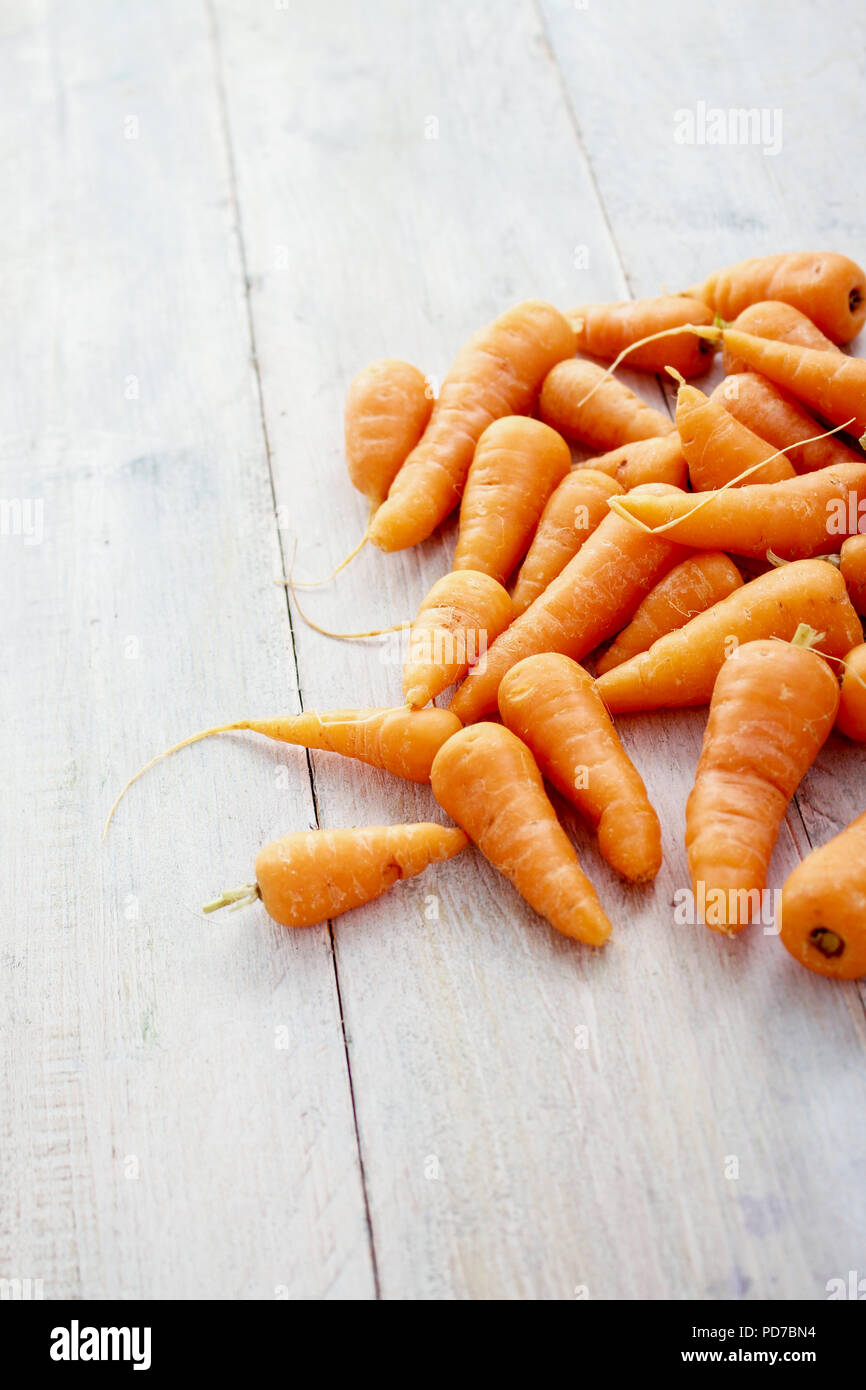 preparing small baby carrots Stock Photo - Alamy