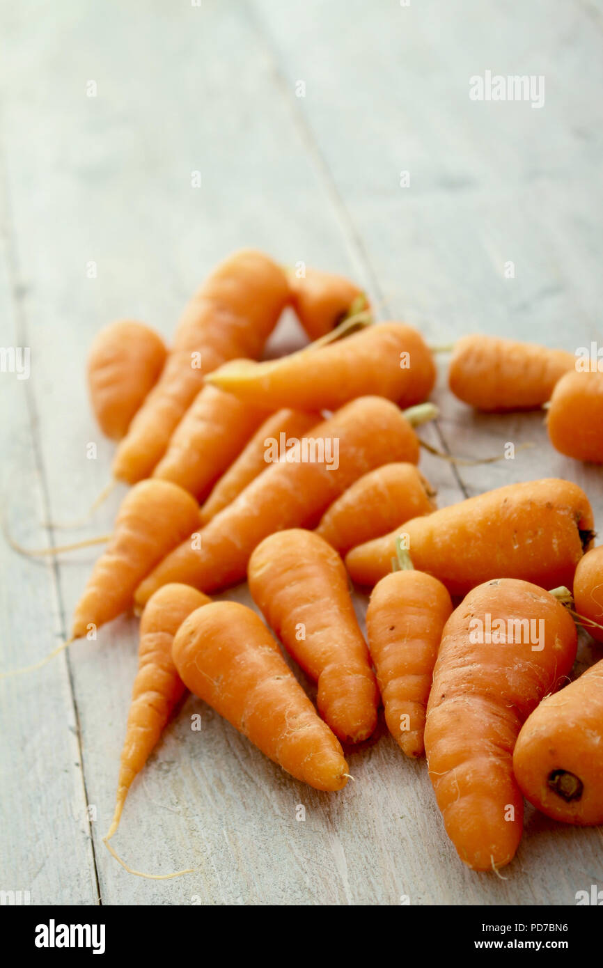 preparing small baby carrots Stock Photo - Alamy