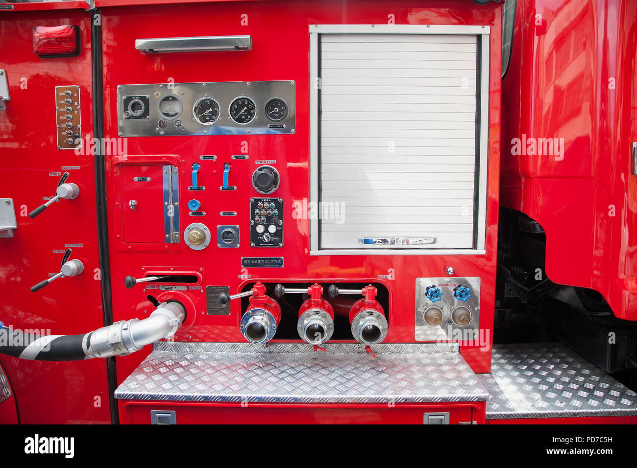 HONG KONG -APR 1, 2016: Fireman fire truck hose faucets in a row red ...
