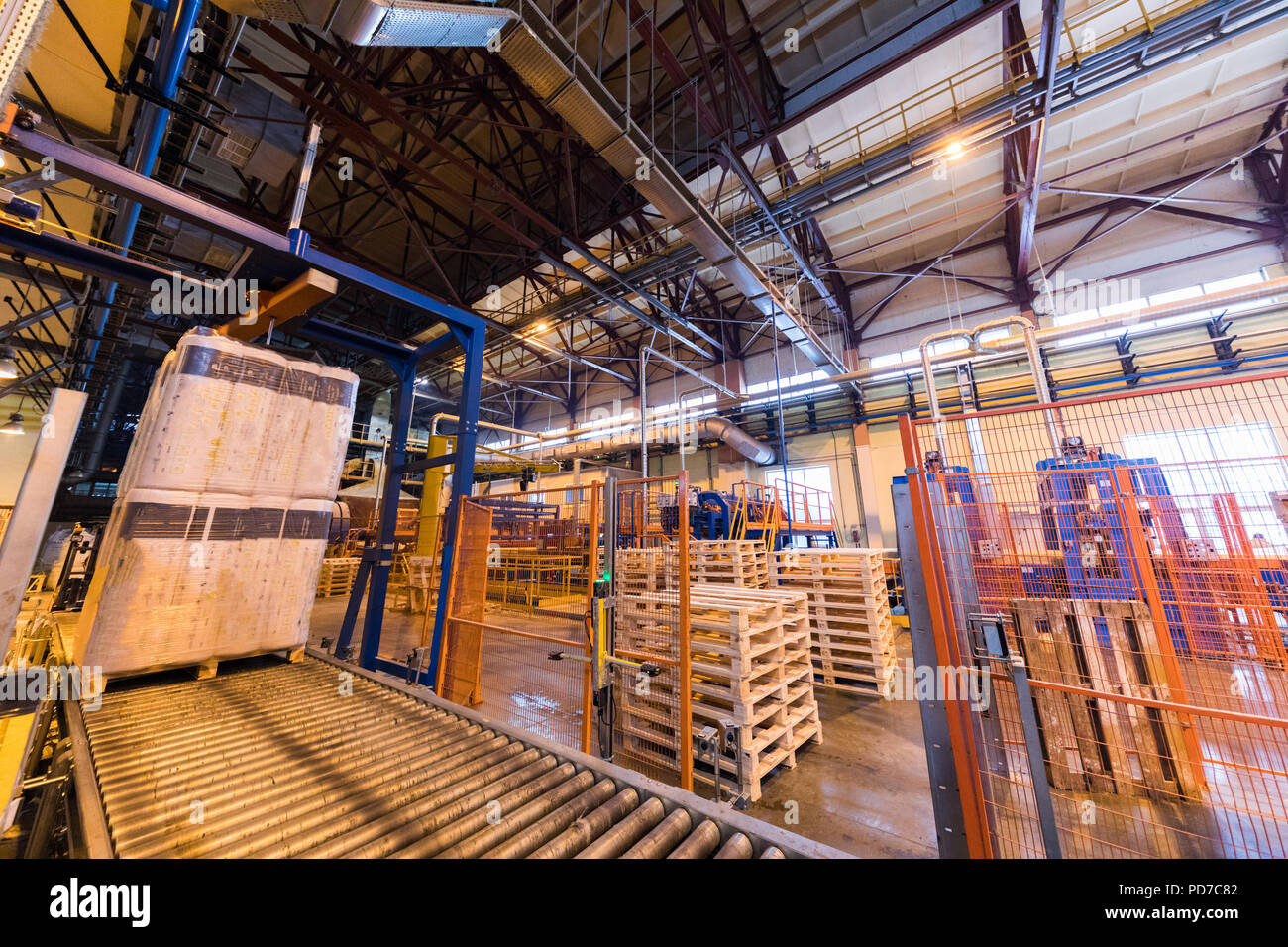 Fiberglass production industry equipment at manufacture background ...