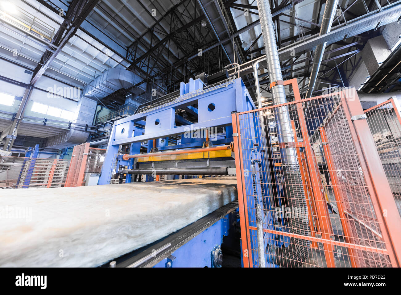 Fiberglass production industry equipment at manufacture background ...