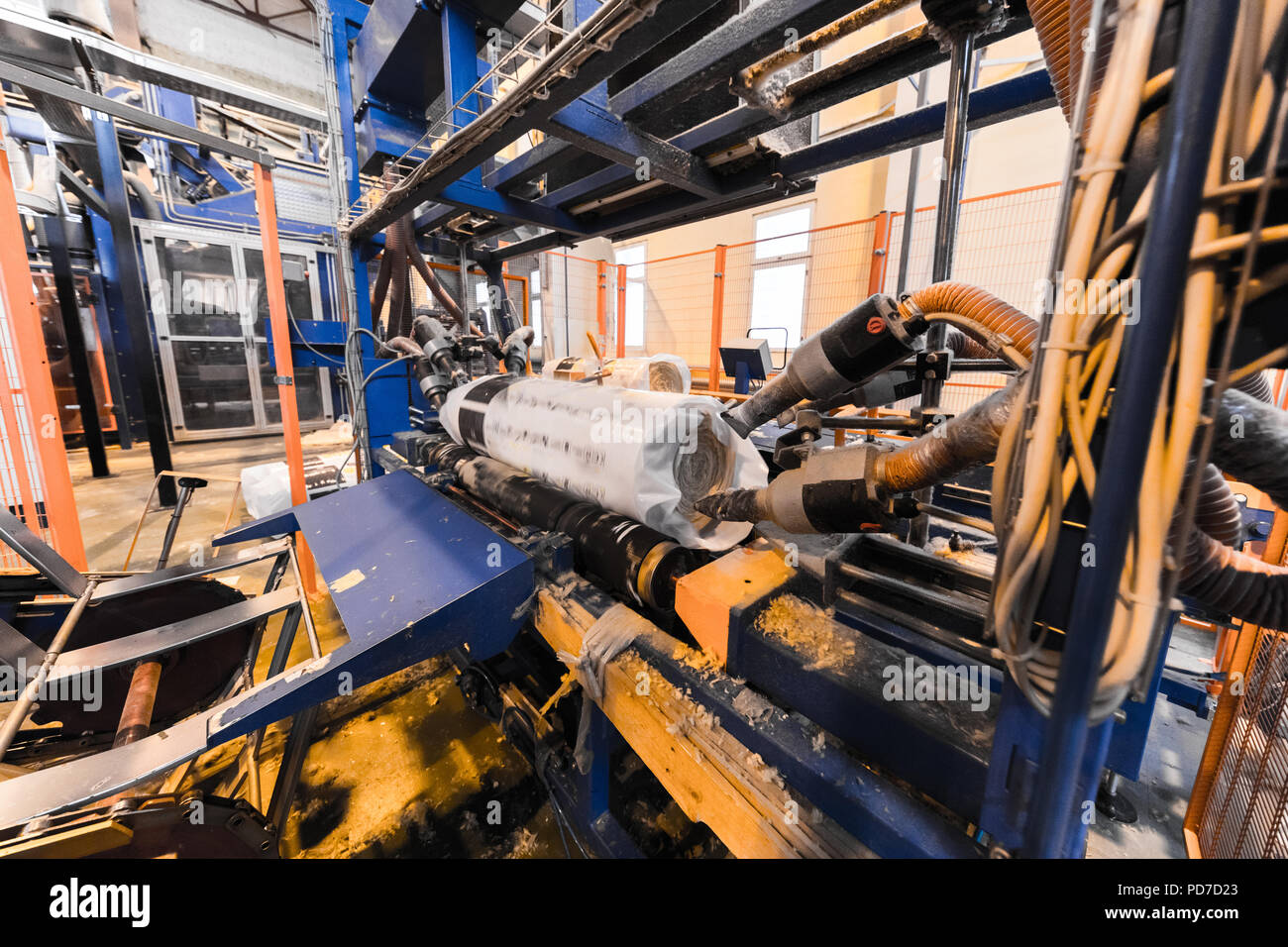 Fiberglass production industry equipment at manufacture background ...