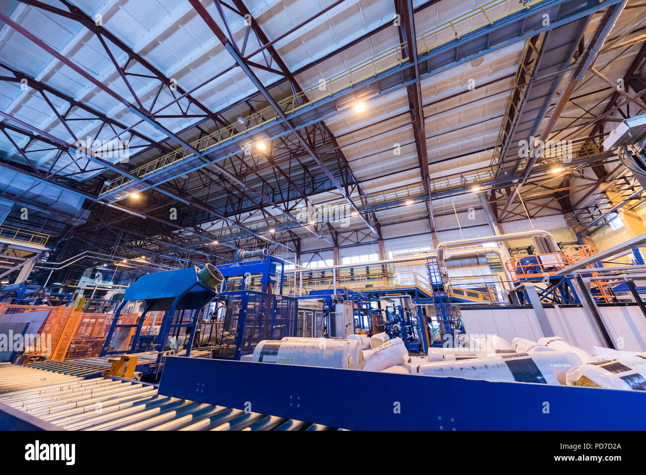 Fiberglass production industry equipment at manufacture background ...