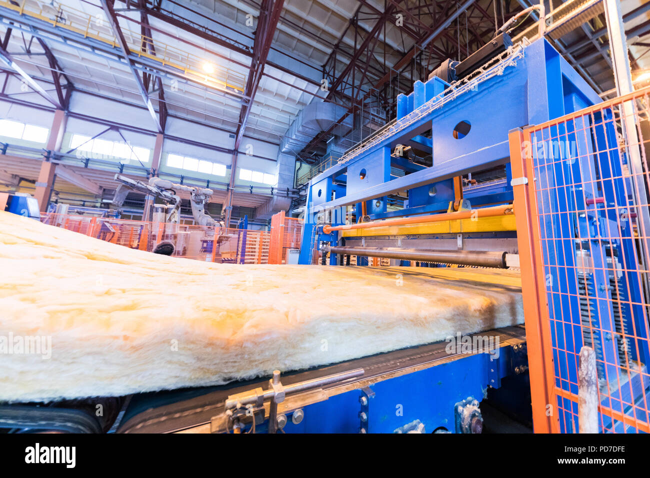 Fiberglass production industry equipment at manufacture background ...