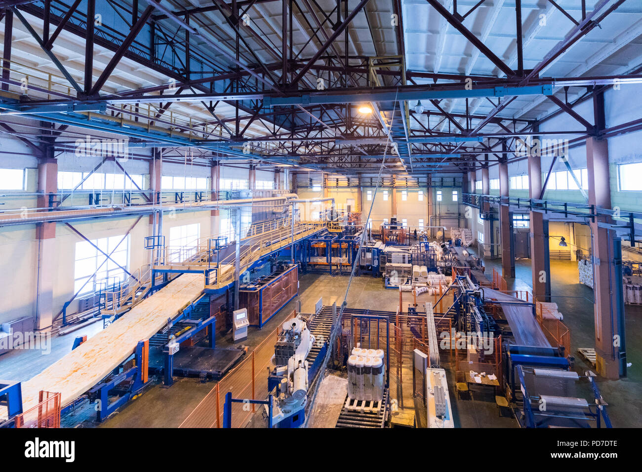 Fiberglass production industry equipment at manufacture background ...