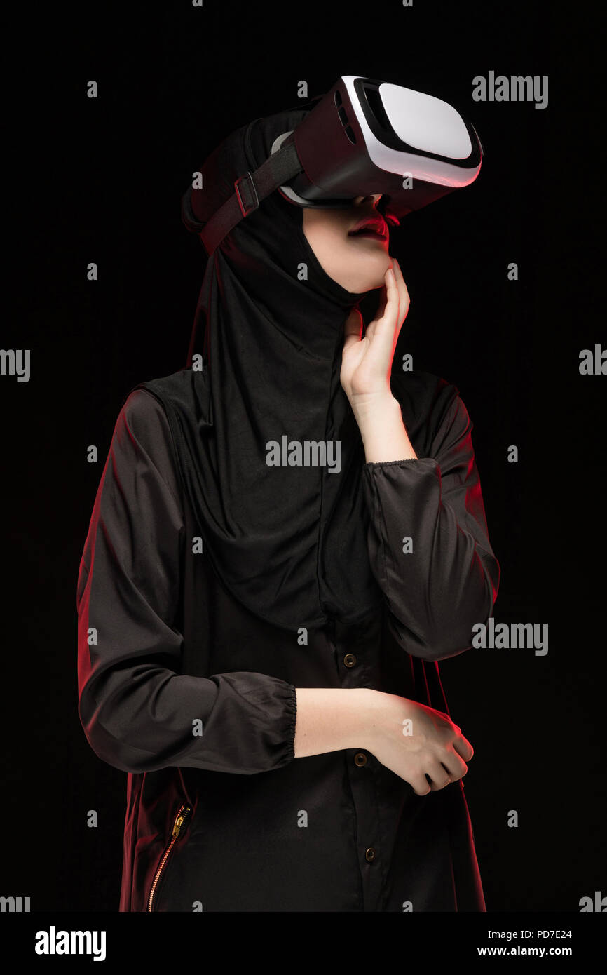 Portrait of beautiful smart young muslim woman wearing black hijab ...