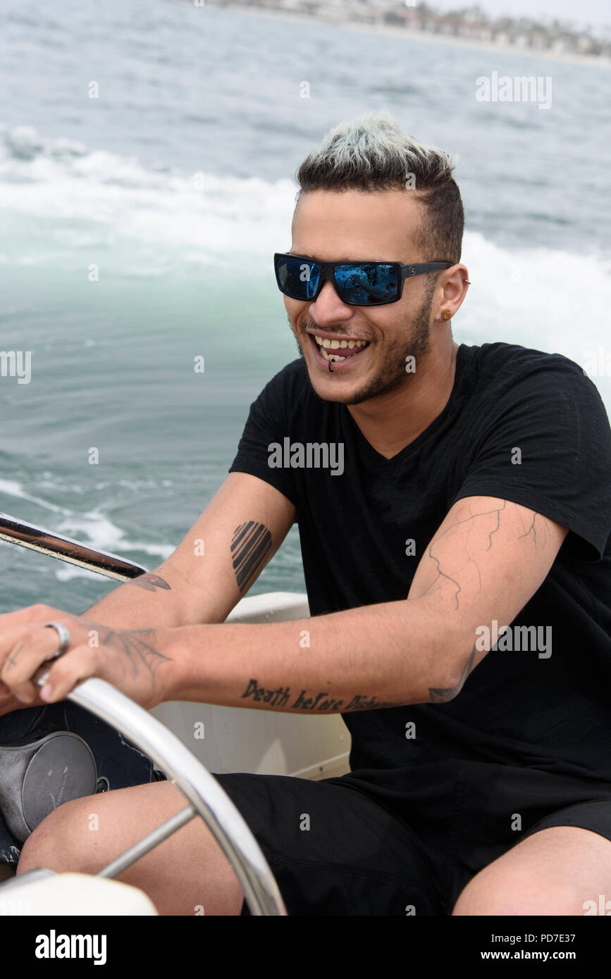Handsome man in a boat hi-res stock photography and images - Alamy