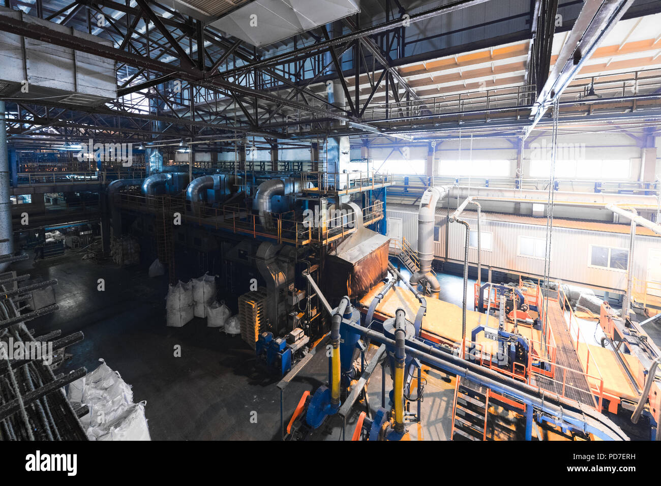 Fiberglass production industry equipment at manufacture background ...