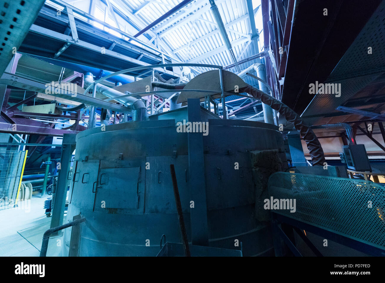 Fiberglass production industry equipment at manufacture background ...