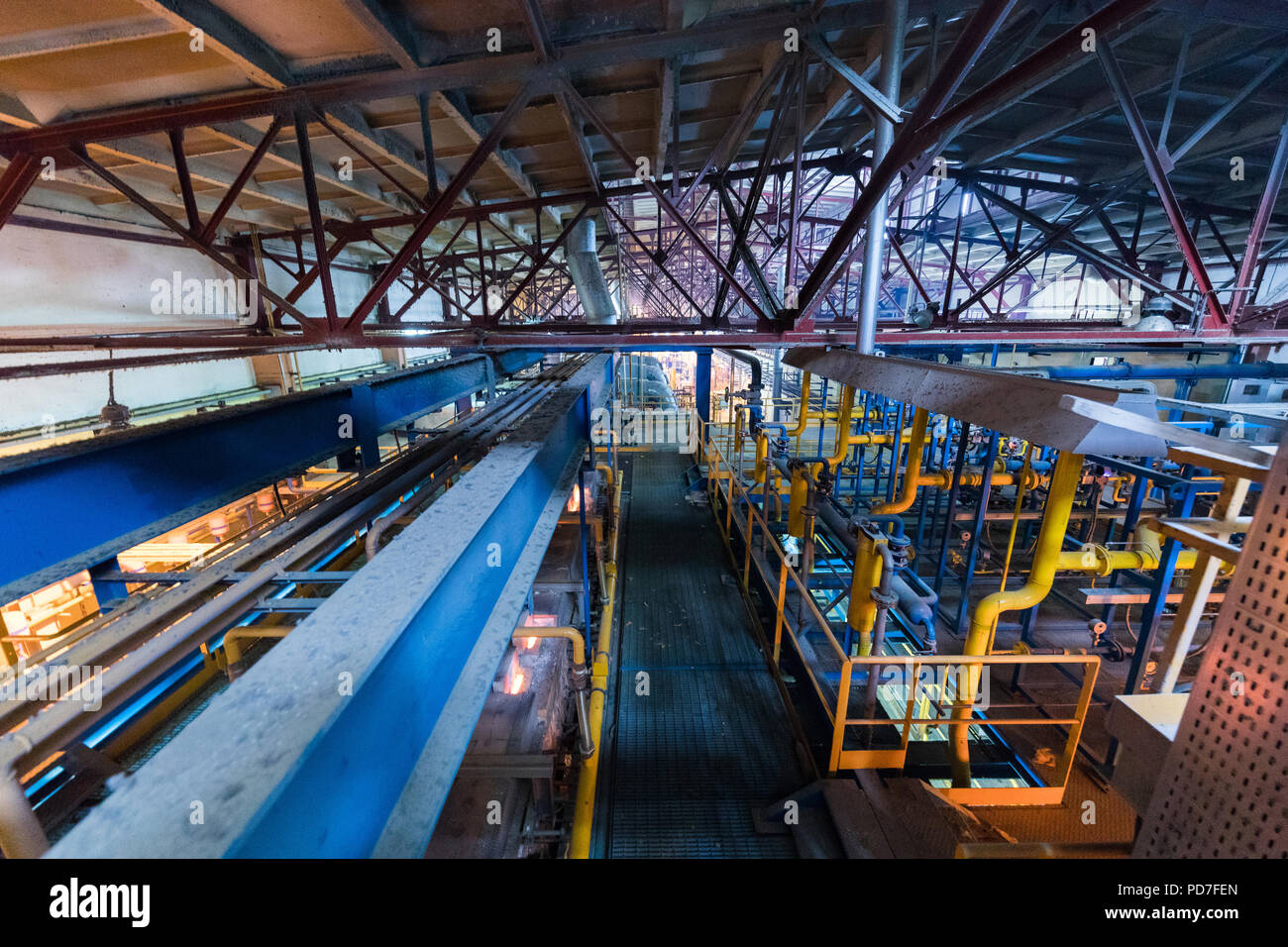 Fiberglass production industry equipment at manufacture background ...