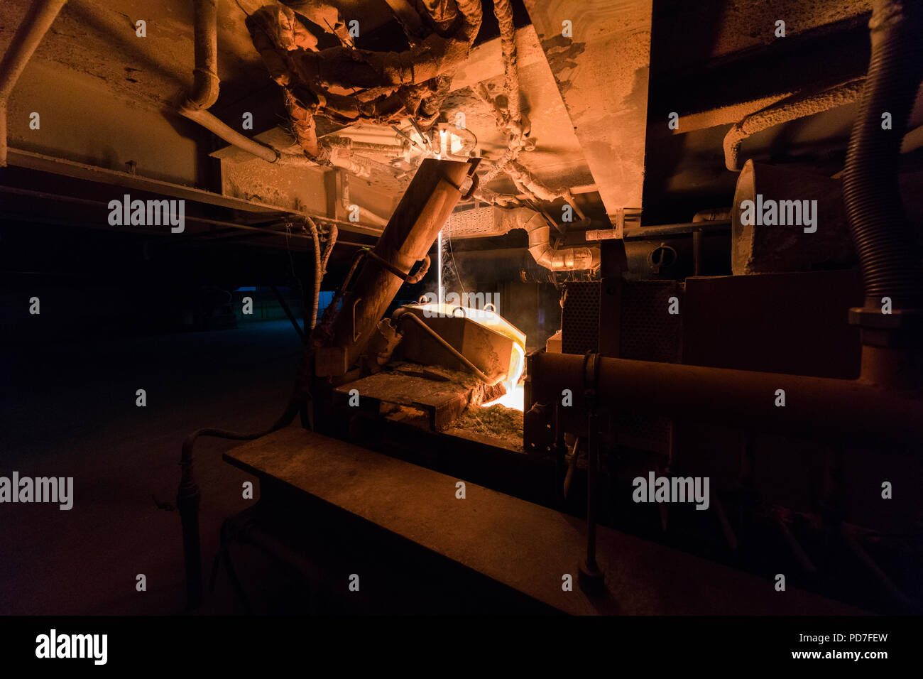 Process of fiberglass production at manufacture background with ...