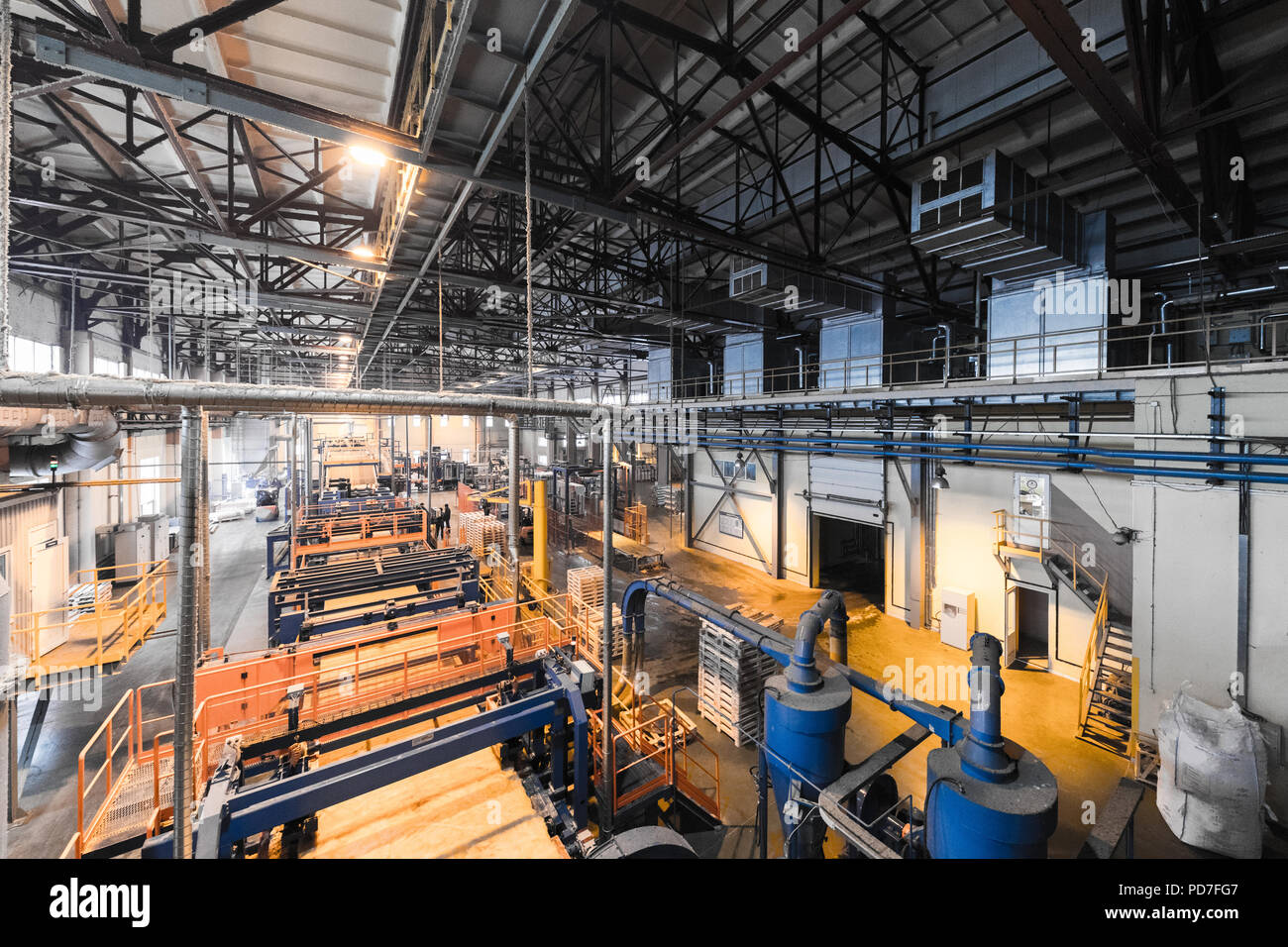 Fiberglass production industry equipment at manufacture background ...
