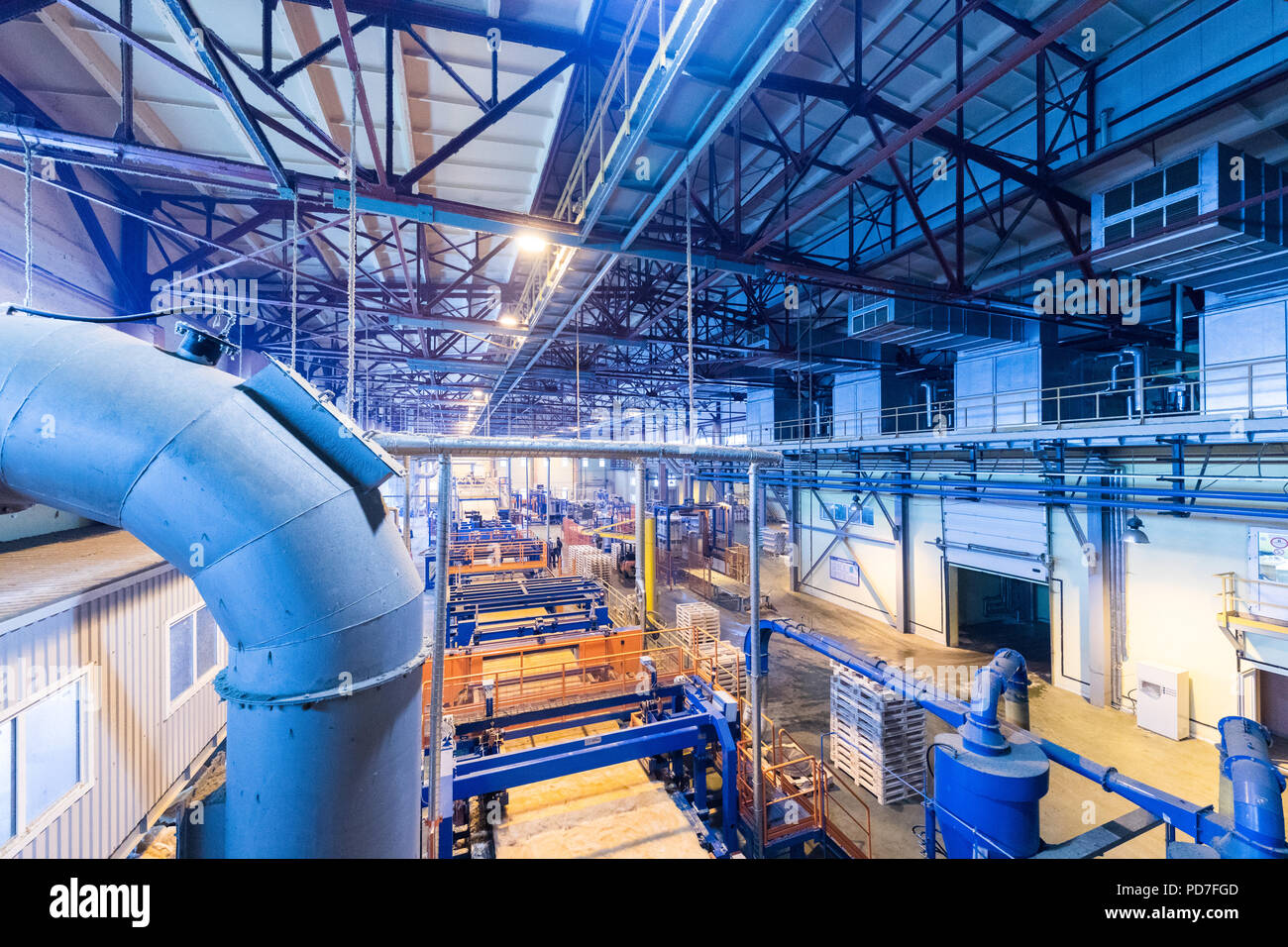 Fiberglass production industry equipment at manufacture background ...