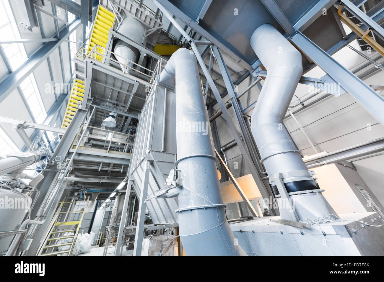 Fiberglass production industry equipment at manufacture background ...