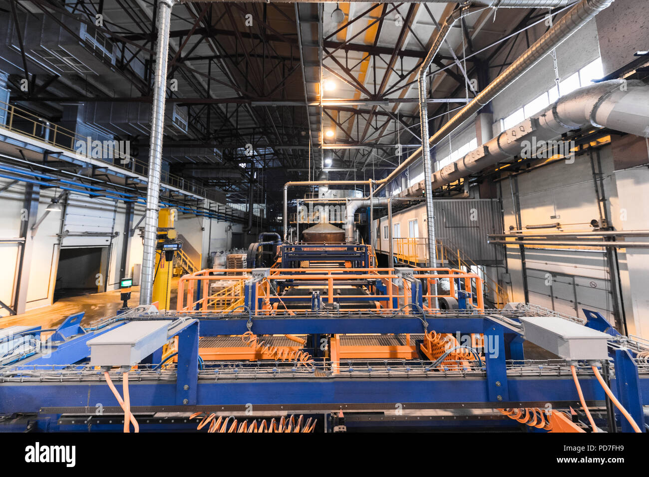 Fiberglass production industry equipment at manufacture background ...