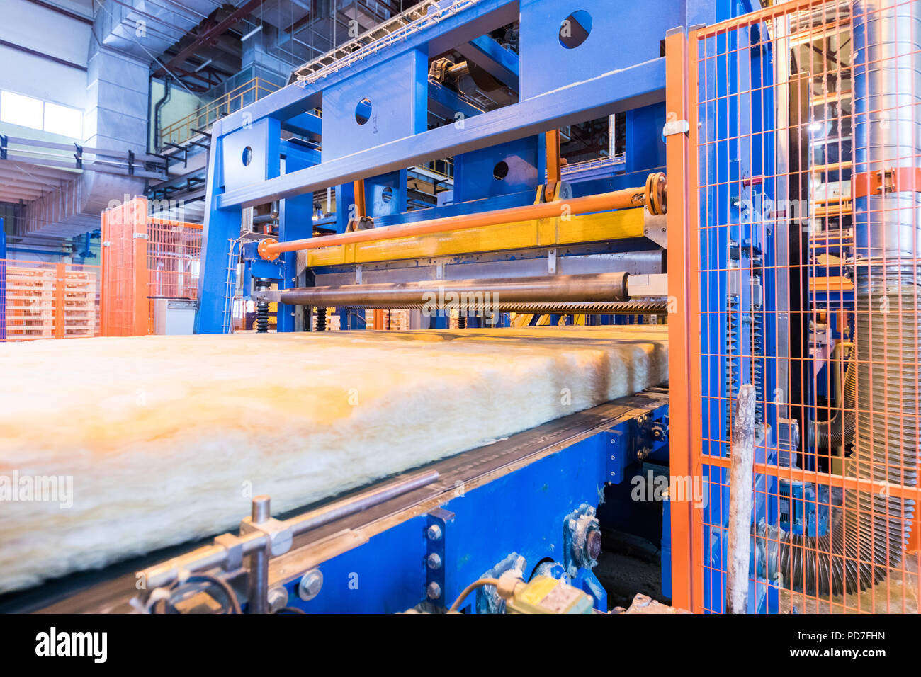 Fiberglass production industry equipment at manufacture background ...