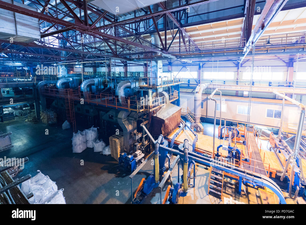 Fiberglass production industry equipment at manufacture background ...