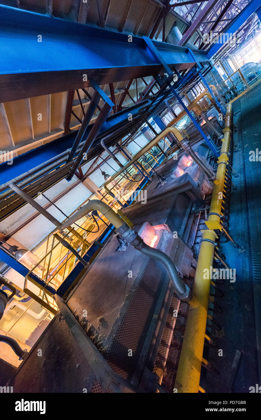 Fiberglass production industry equipment at manufacture background ...