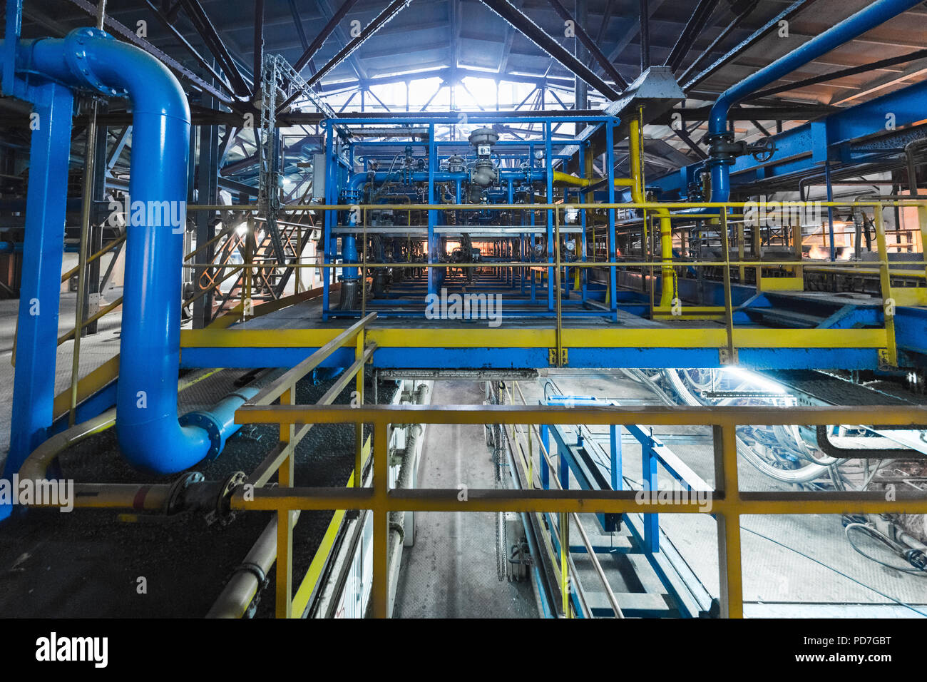 Fiberglass production industry equipment at manufacture background ...