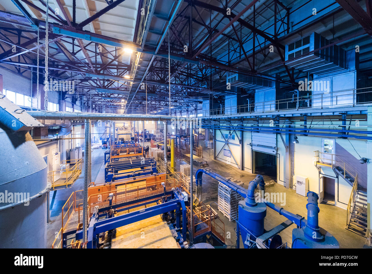 Fiberglass production industry equipment at manufacture background ...