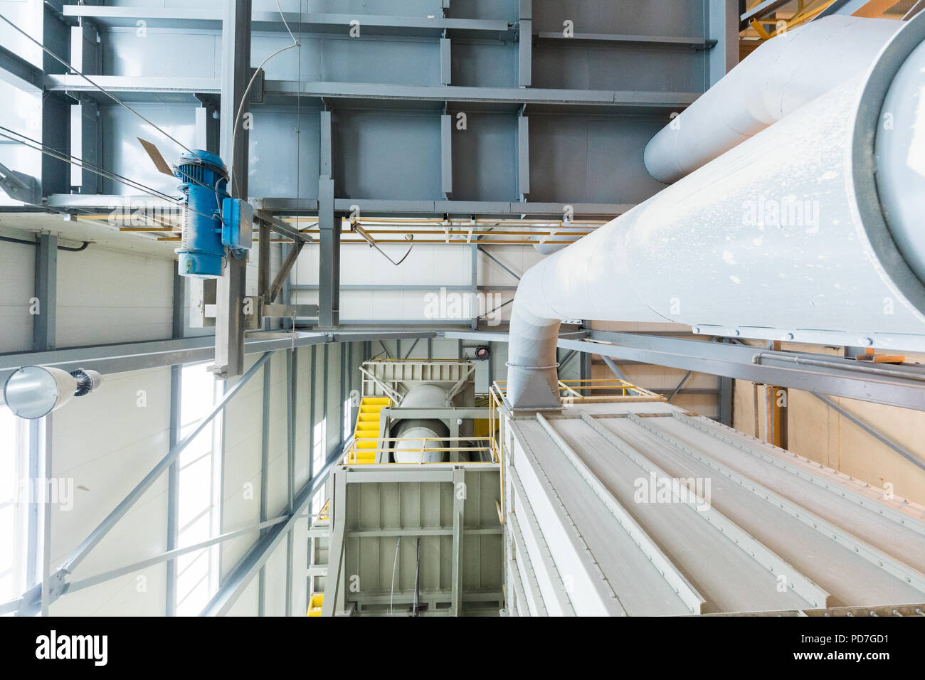 Fiberglass production industry equipment at manufacture background ...