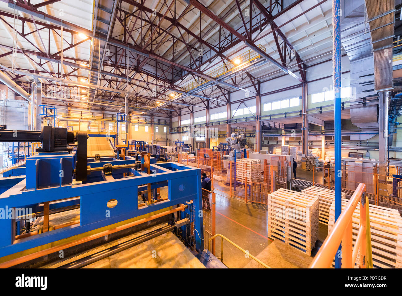 Fiberglass production industry equipment at manufacture background ...