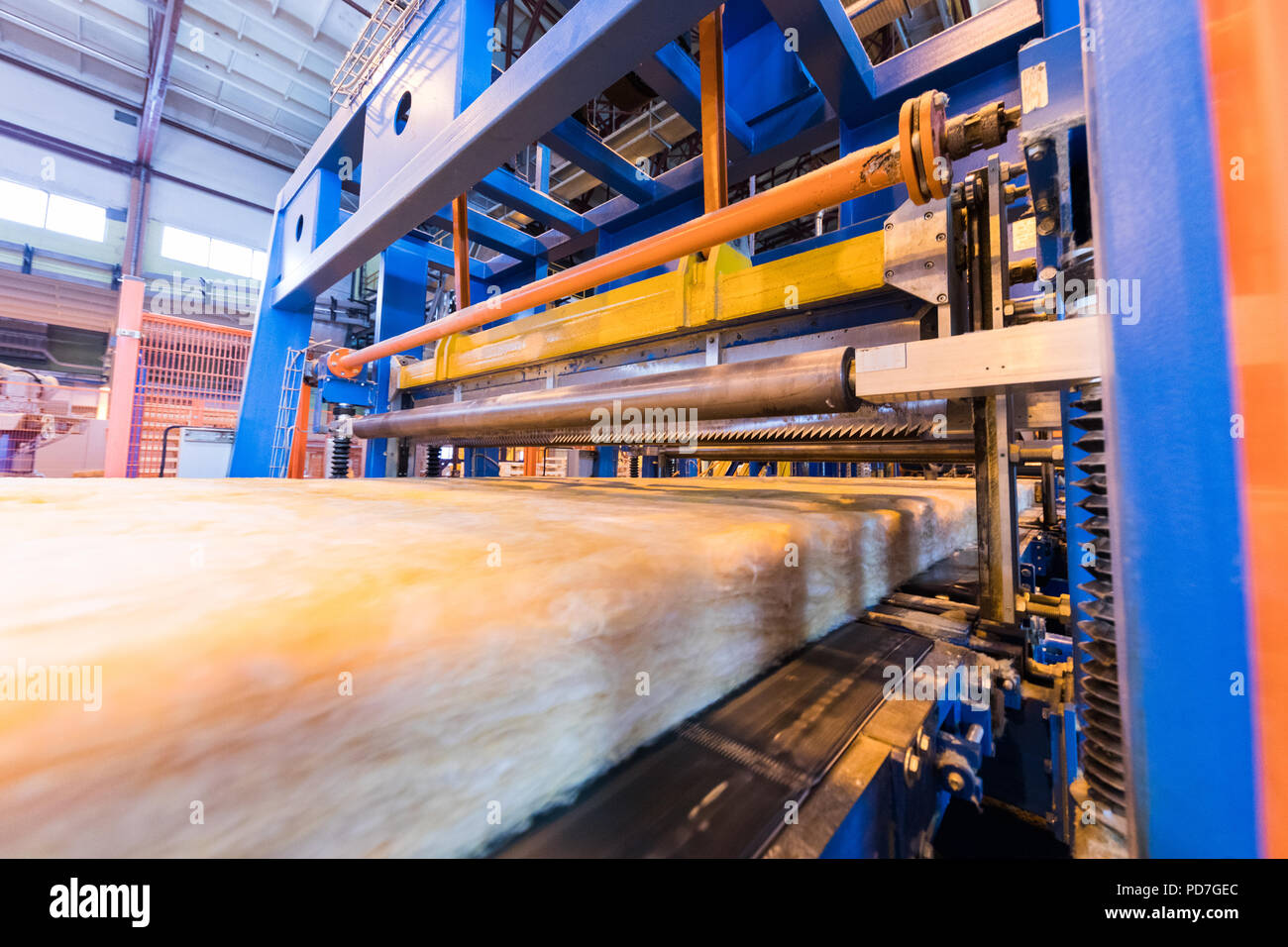 Fiberglass production industry equipment at manufacture background ...