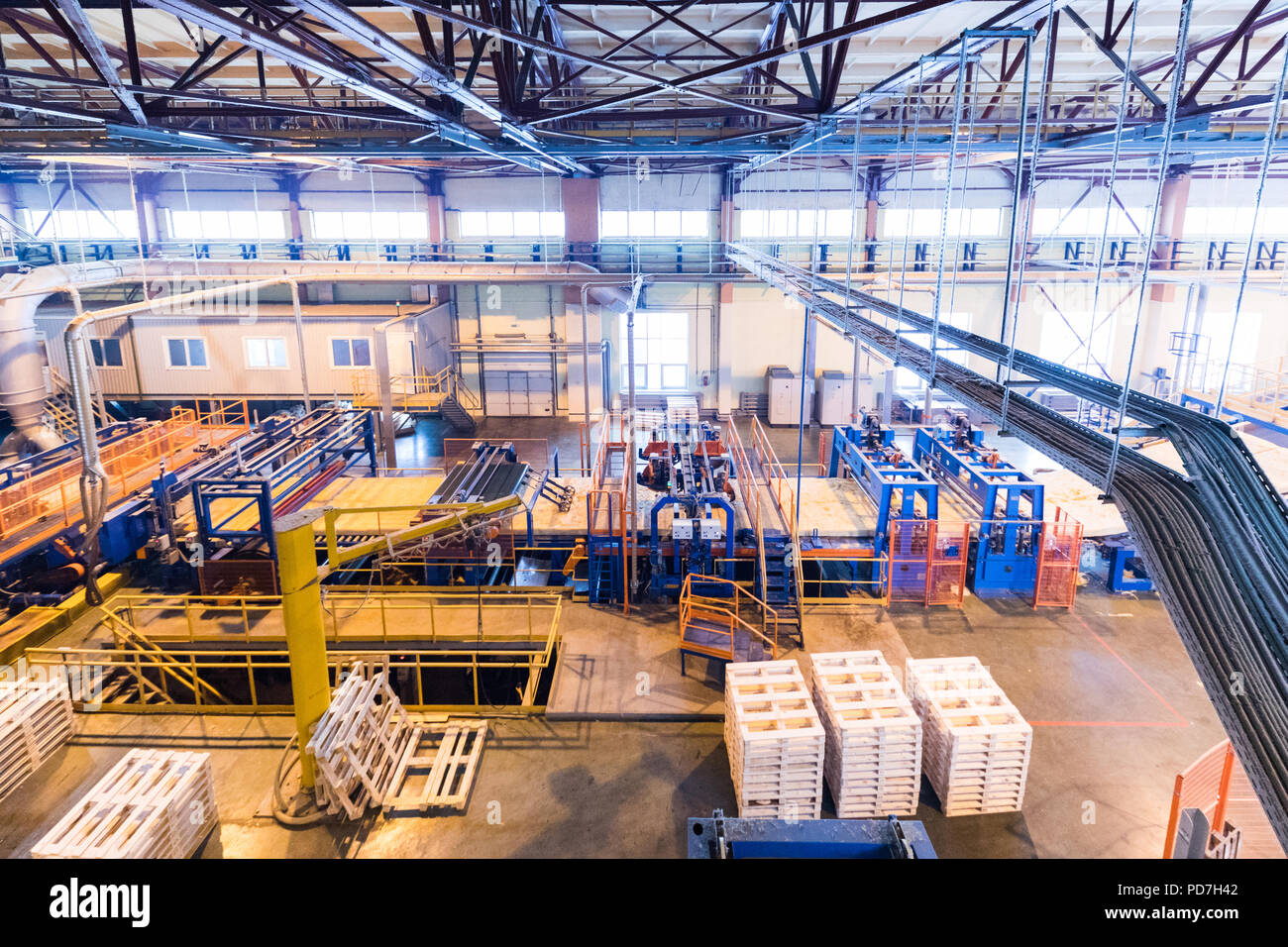 Fiberglass production industry equipment at manufacture background ...