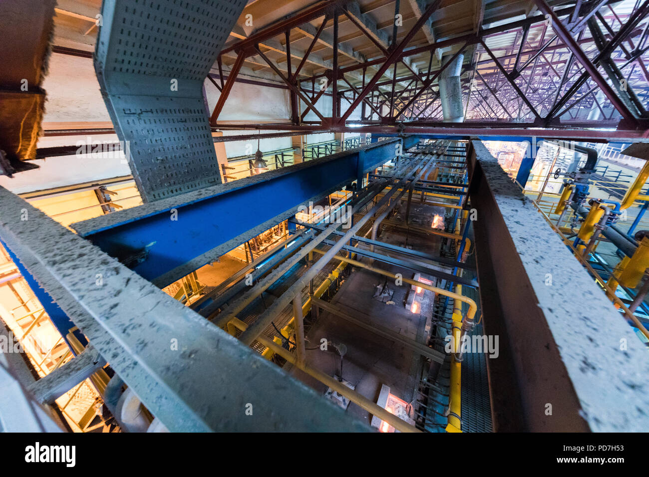 Fiberglass production industry equipment at manufacture background ...