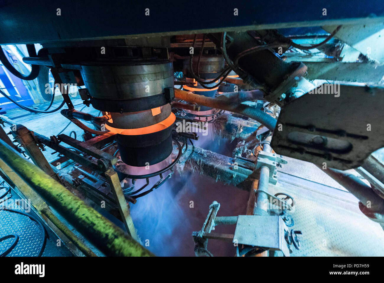 Fiberglass production industry equipment at manufacture background ...