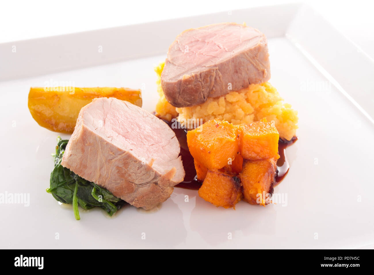 plated pork dinner Stock Photo - Alamy