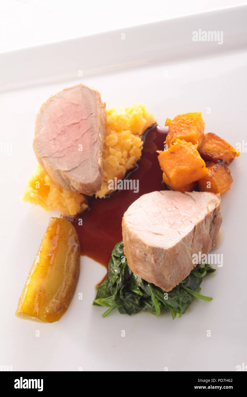 plated pork dinner Stock Photo - Alamy
