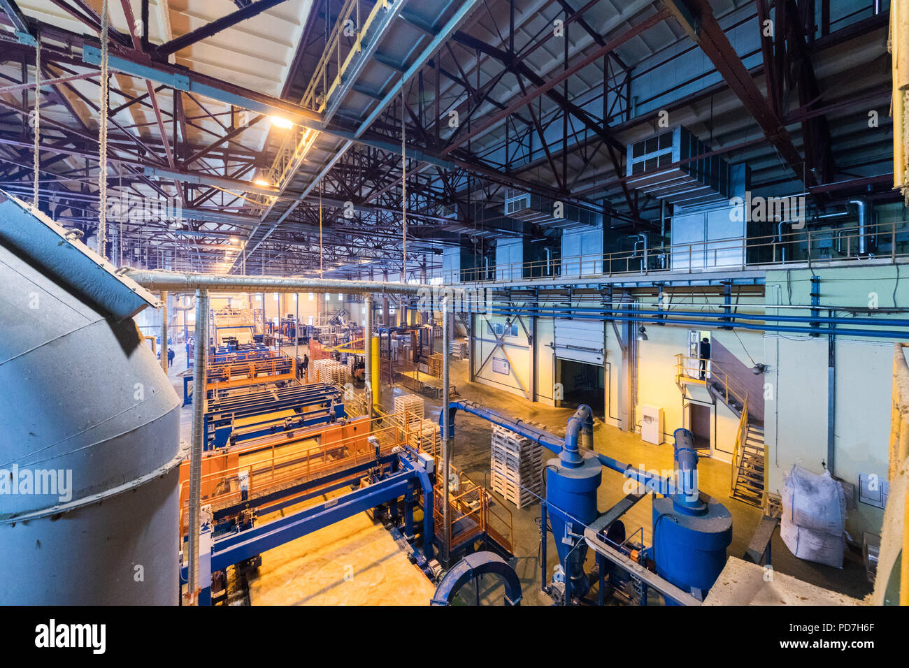 Fiberglass production industry equipment at manufacture background ...