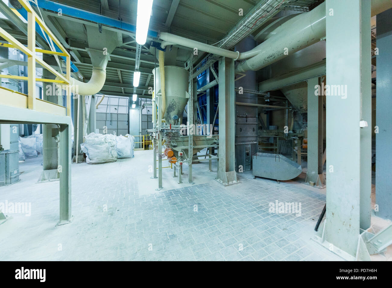 Fiberglass production industry equipment at manufacture background ...