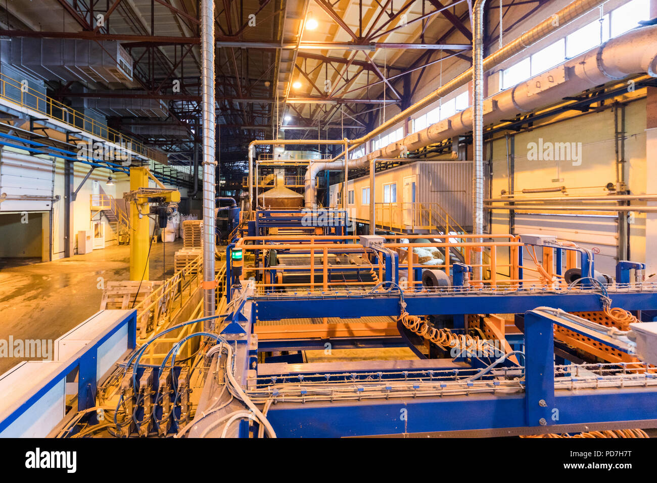 Fiberglass production industry equipment at manufacture background ...