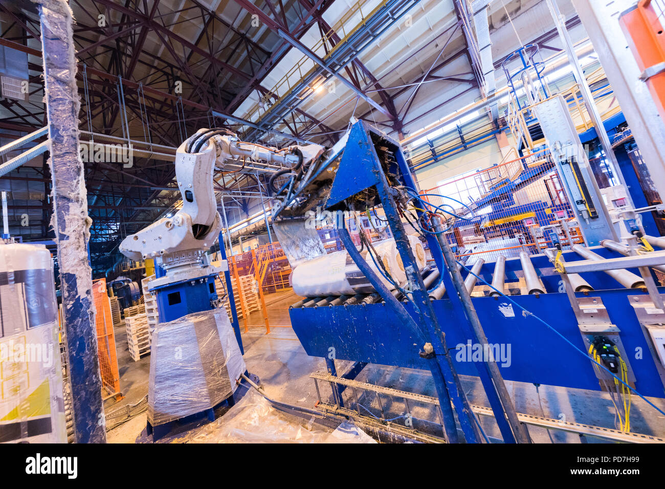 Fiberglass production industry equipment at manufacture background ...