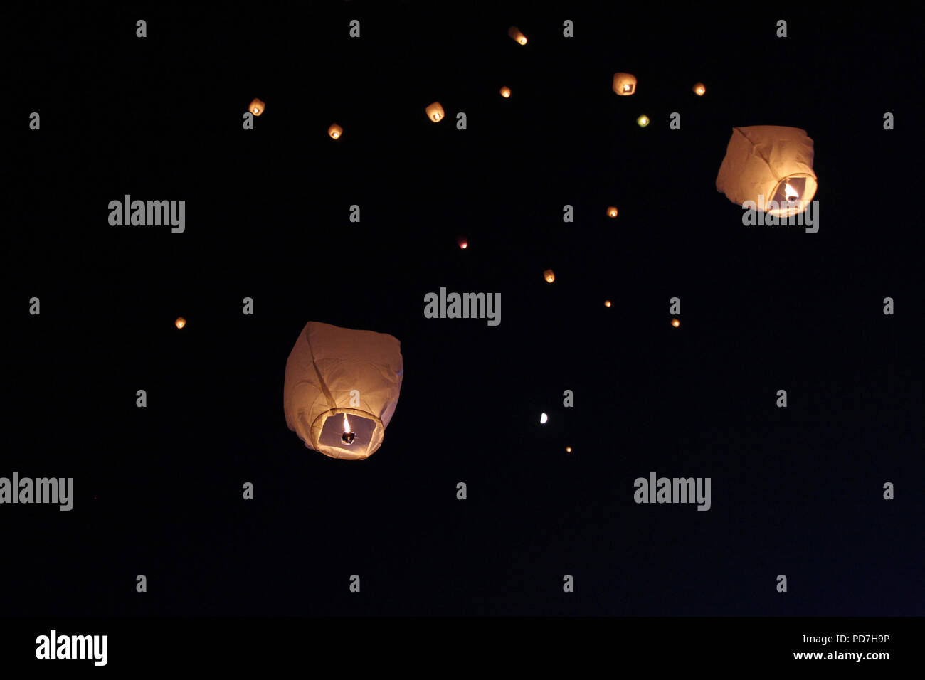 Sky lanterns floating in the sky. Deepavali lights festival. Chinese ...