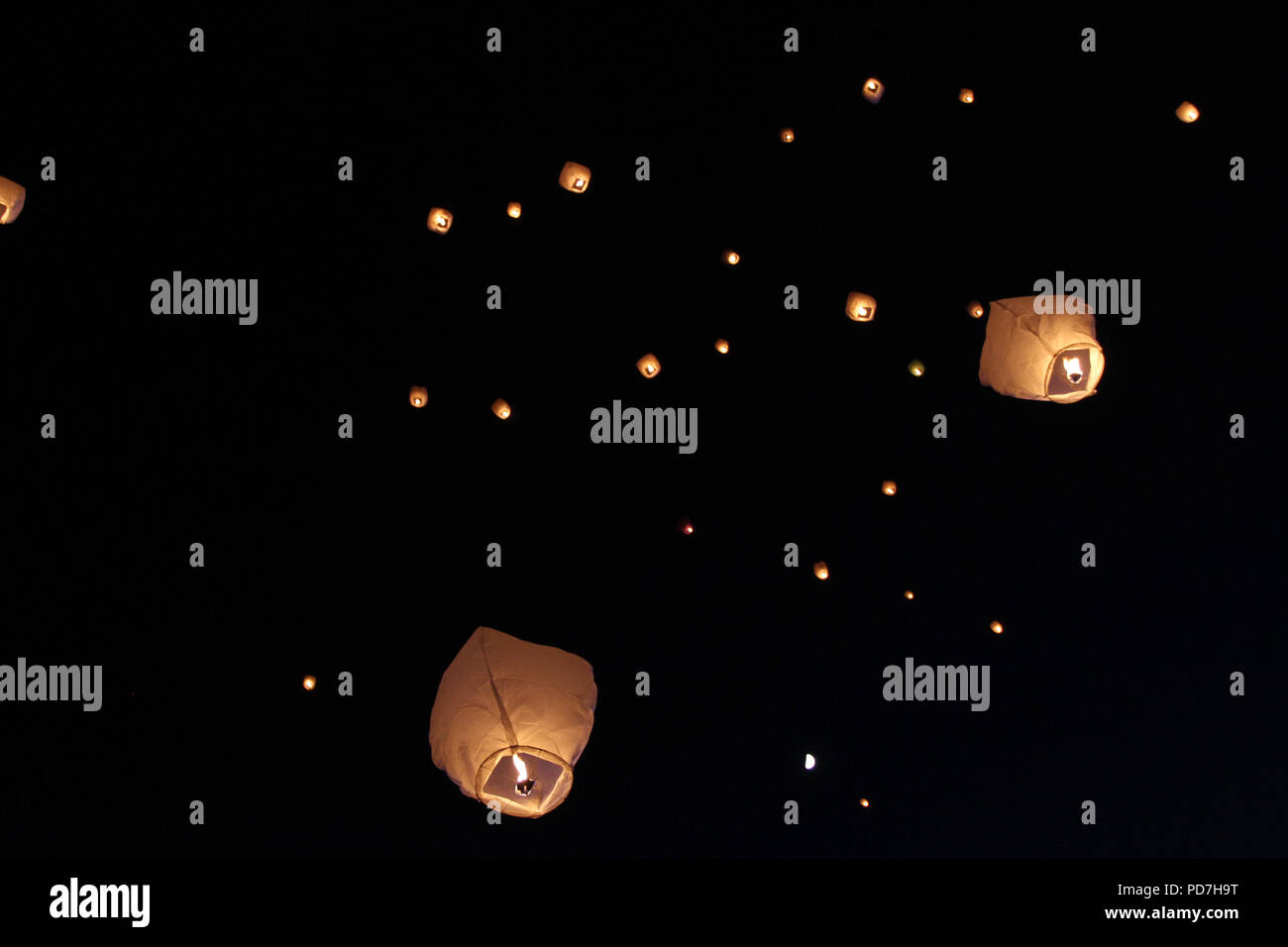 Sky lanterns floating in the sky. Deepavali lights festival. Chinese ...