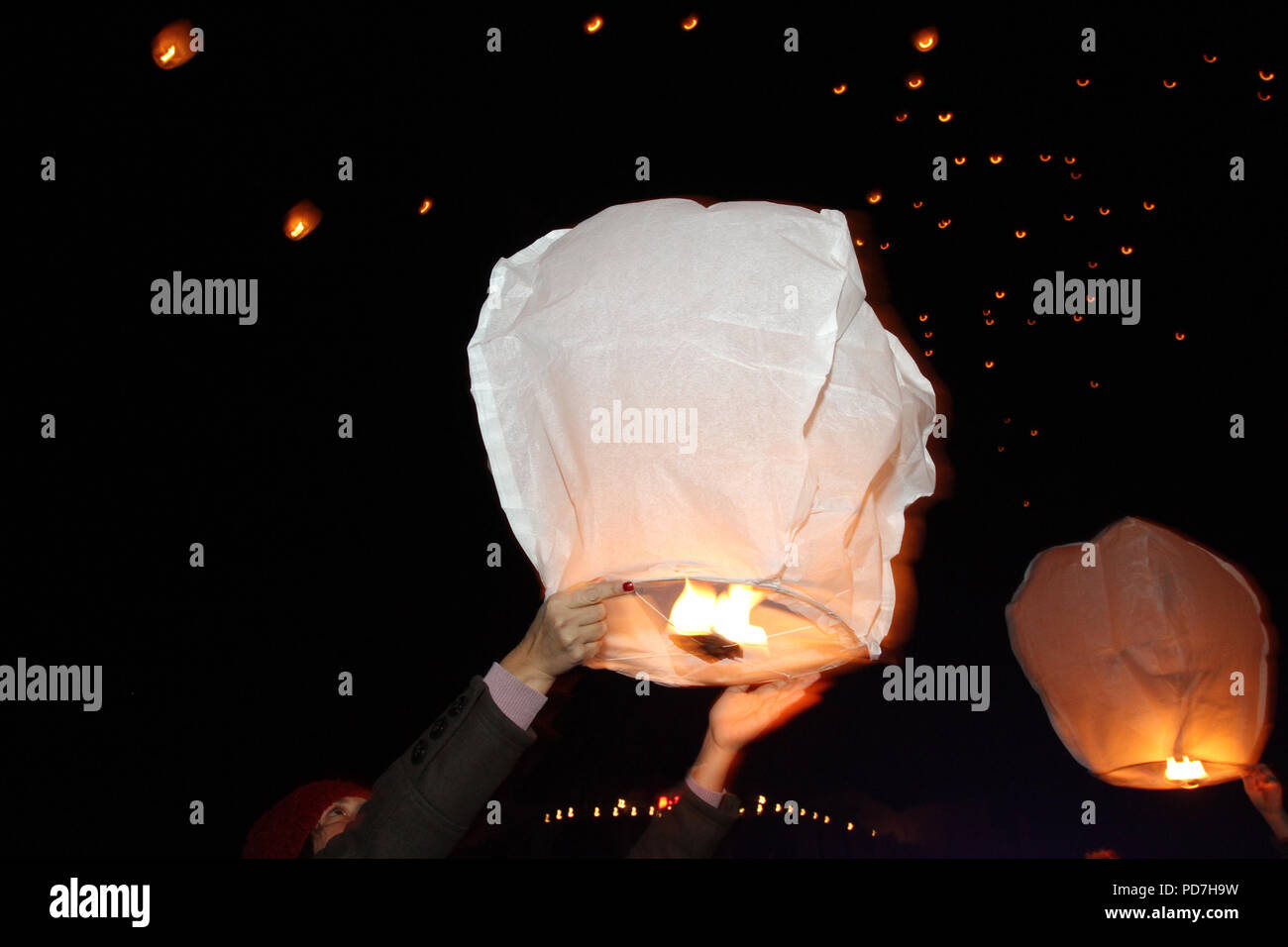 Sky lanterns floating in the sky. Deepavali lights festival. Chinese ...