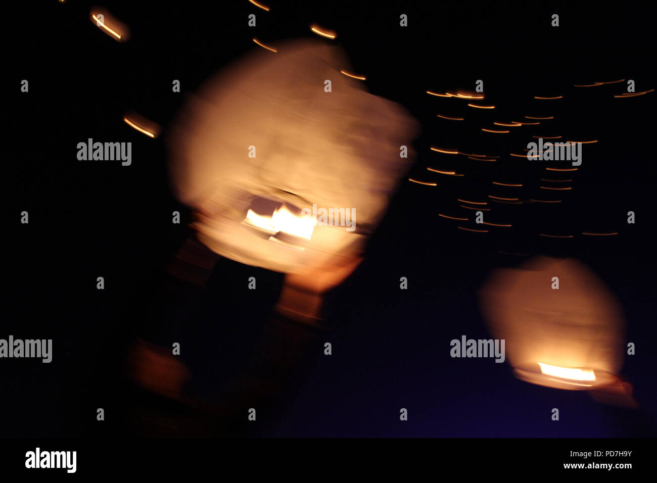 Sky lanterns floating in the sky. Deepavali lights festival. Chinese ...