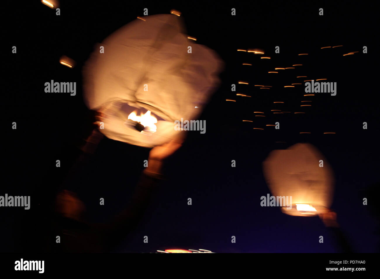 Sky lanterns floating in the sky. Deepavali lights festival. Chinese ...