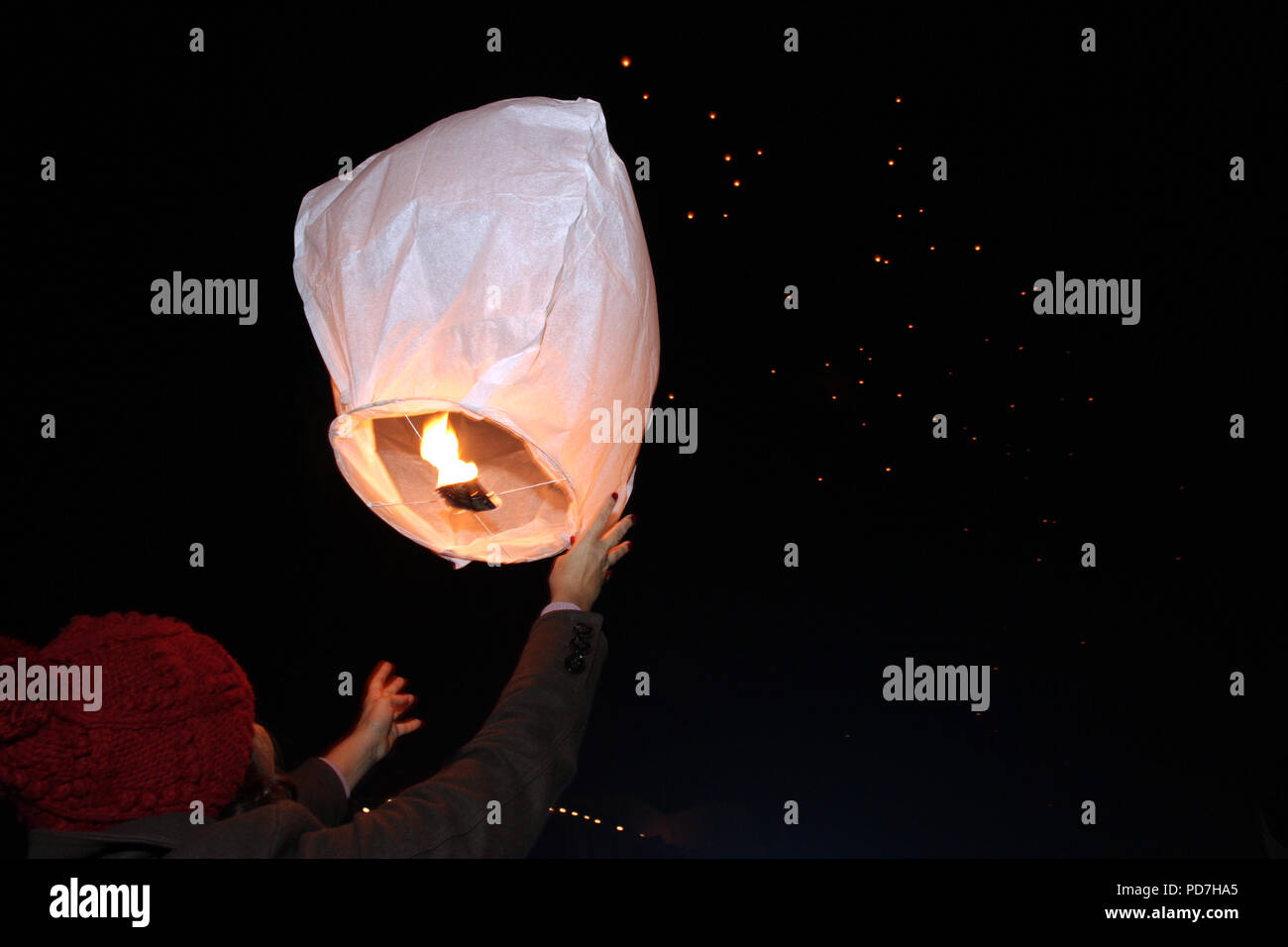 Sky lanterns floating in the sky. Deepavali lights festival. Chinese ...