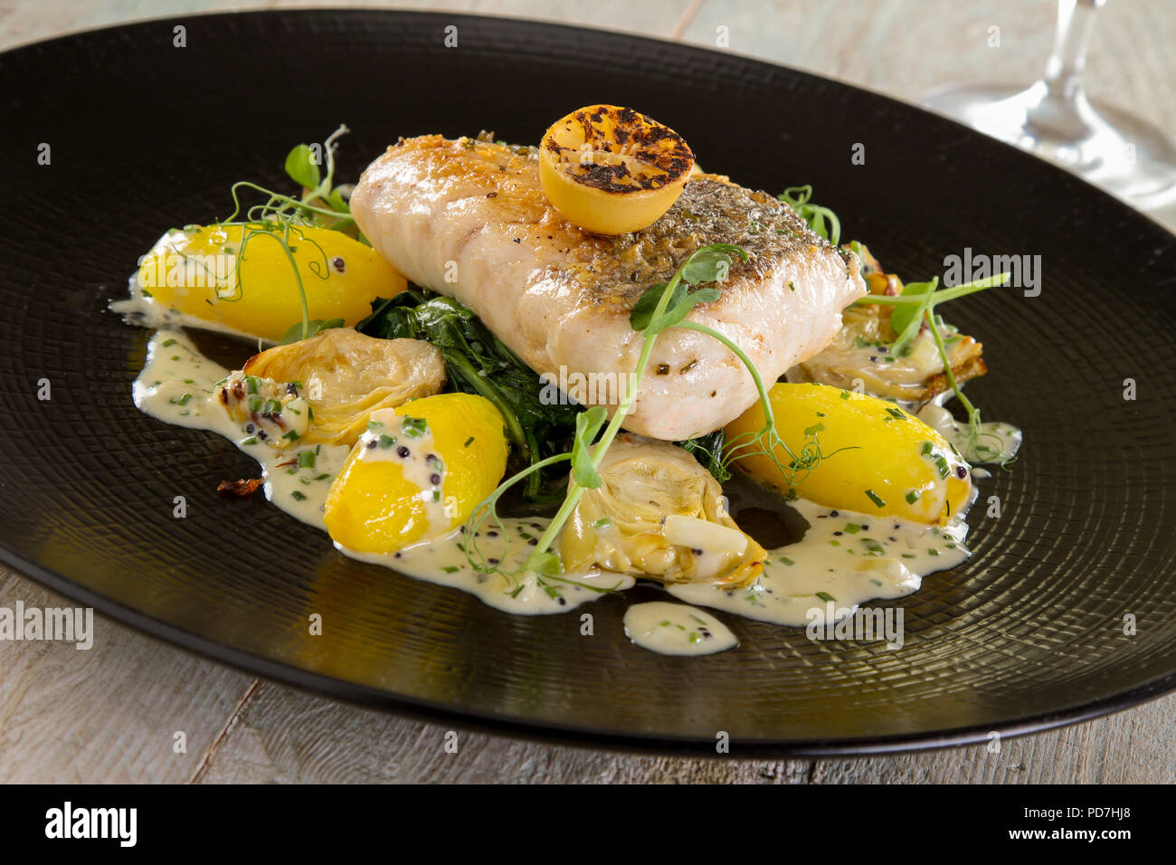 plated fish cod loin main meal Stock Photo - Alamy