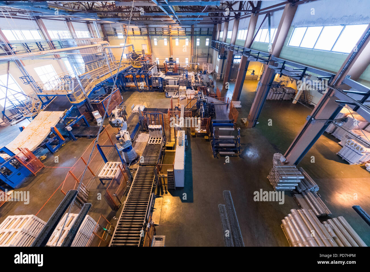 Fiberglass production industry equipment at manufacture background ...