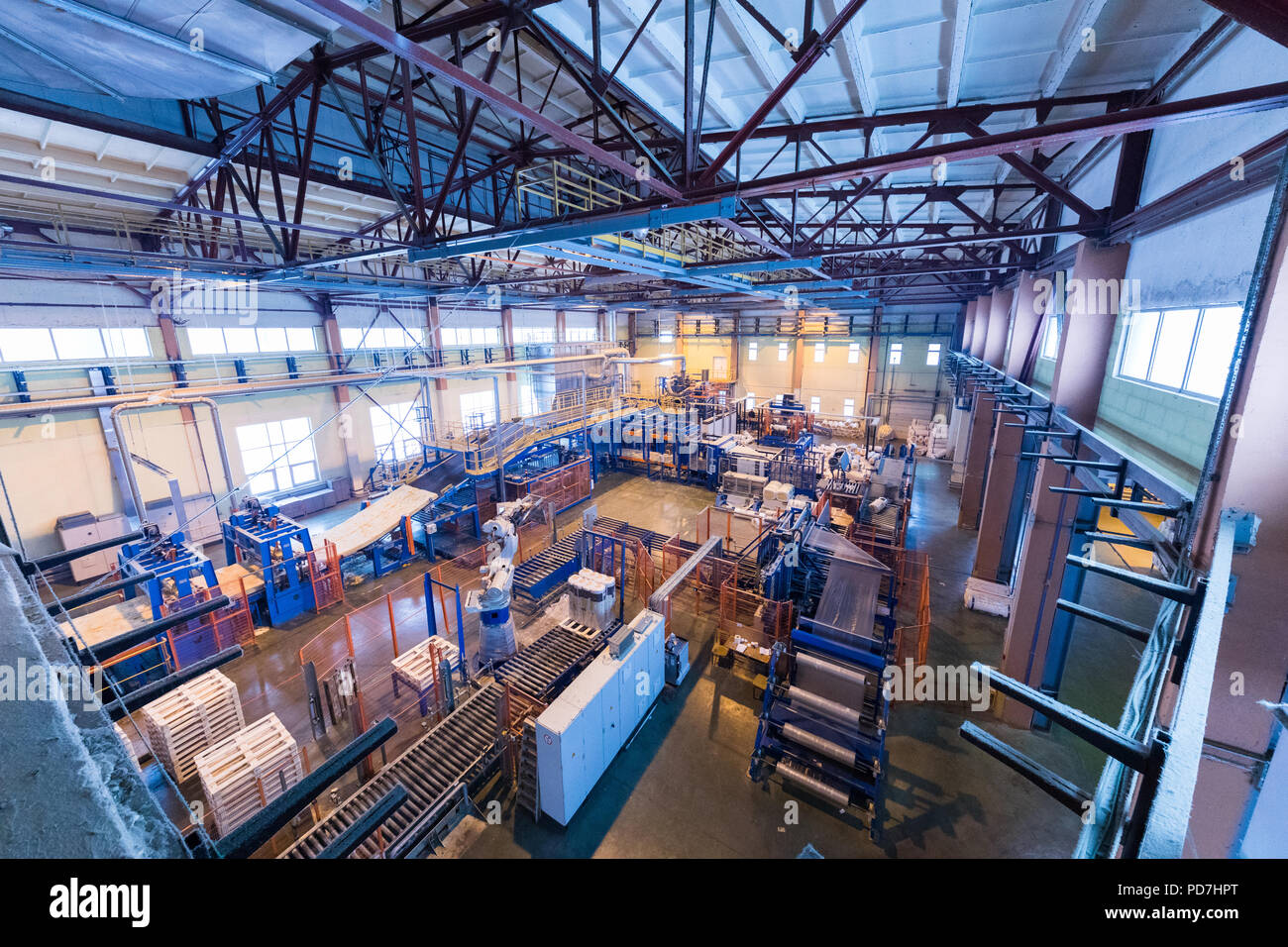 Fiberglass production industry equipment at manufacture background ...